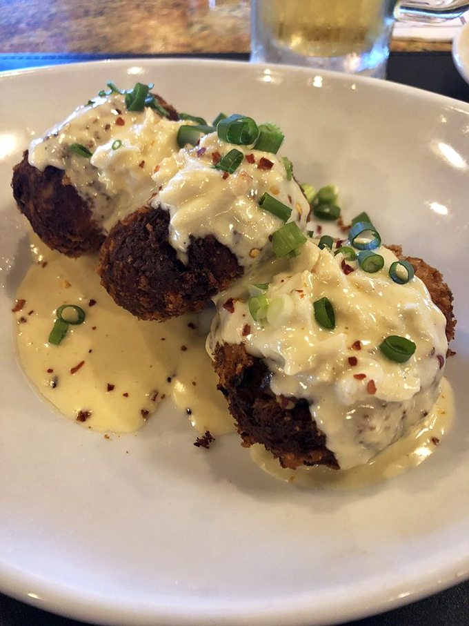 These crab cakes aren't just appetizers&mdash;they're little islands of seafood bliss swimming in a sea of delicious sauce.