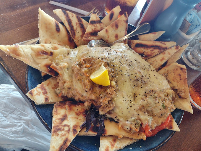 Not all heroes wear capes&mdash;some come as warm crab dip surrounded by grilled pita points ready for their dipping destiny.