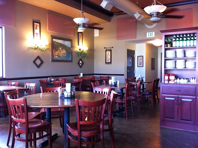 Cherry-red chairs against earth-toned walls create that perfect "come as you are" vibe where both first dates and family reunions feel equally at home.