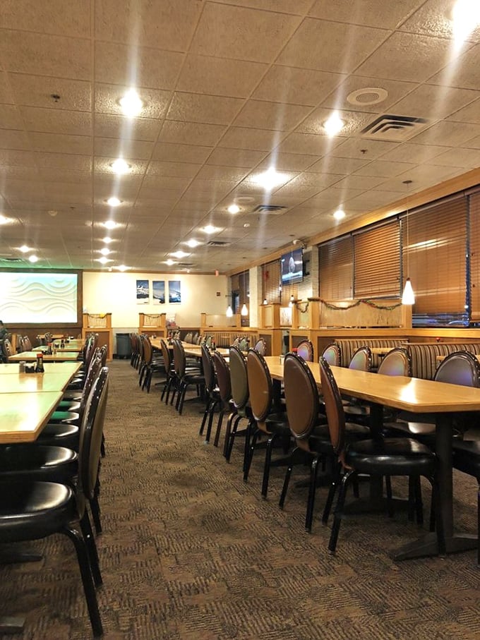 Empty tables that won't stay that way for long. Like a calm sea before a hungry storm, this dining area awaits the next wave of seafood enthusiasts.