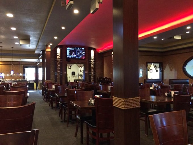The dining room's warm wood tones and subtle lighting create the perfect backdrop for your multiple trips to the buffet line.