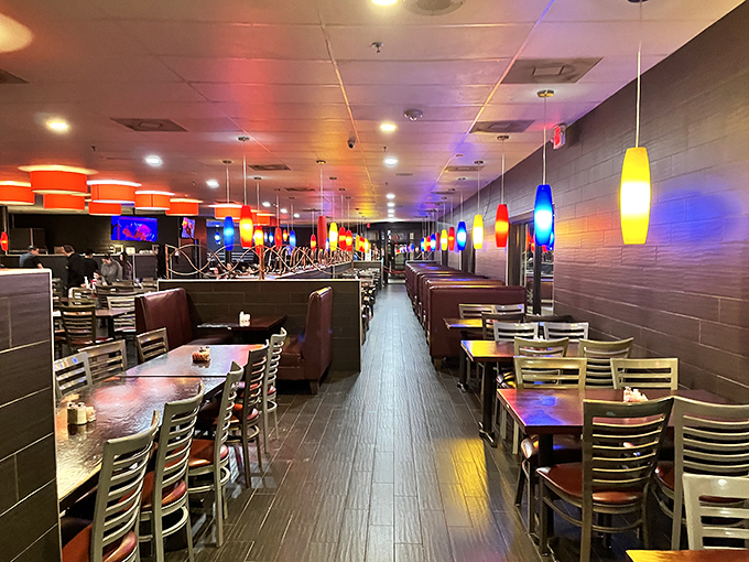 The dining area's colorful pendant lights cast a warm glow over proceedings, creating the perfect atmosphere for serious eating business.