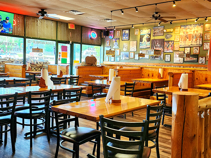 The dining room waits for its daily congregation, where wooden tables will soon become altars for barbecue worship.