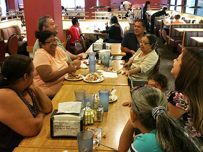 The dining room hums with the energy of happy eaters. Notice how nobody's looking at their phones? Food this good demands full attention.