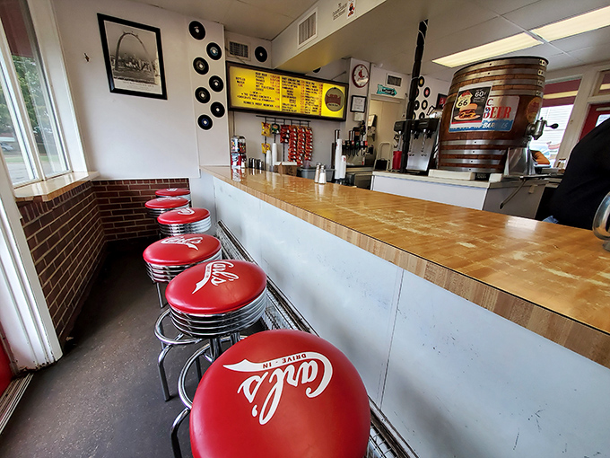 These red stools aren't just seats&mdash;they're front-row tickets to a culinary performance that's been running for decades.
