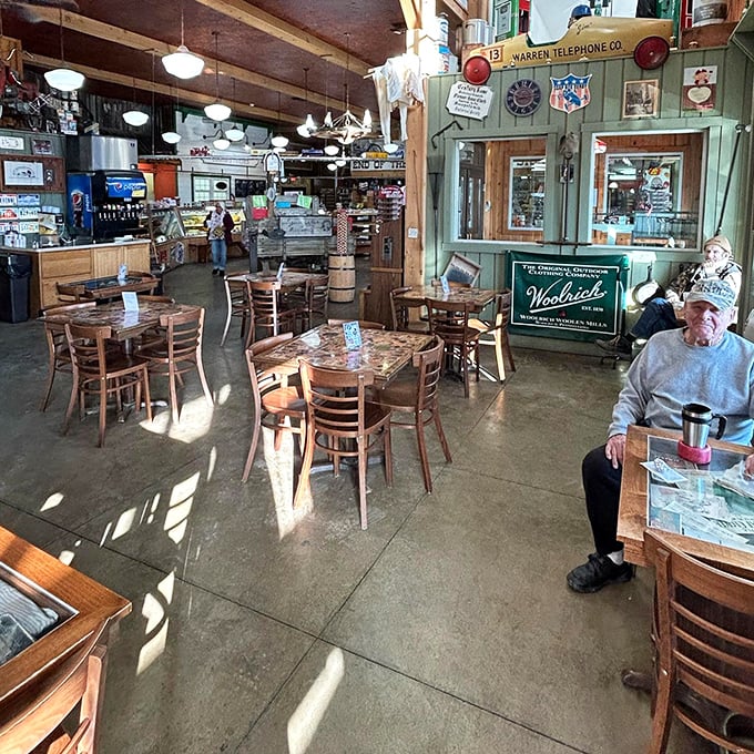 The dining area where strangers become friends over coffee and pie&mdash;notice the gentleman enjoying his moment of peace in this bustling time capsule.