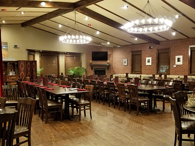 The dining room's circular chandeliers and exposed brick create an atmosphere where memories are made between bites of legendary steaks.