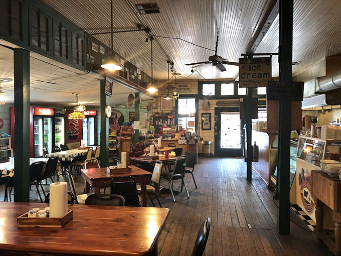 The dining room tells stories without saying a word &ndash; worn wooden tables, ceiling fans, and decades of conversations hanging in the air.