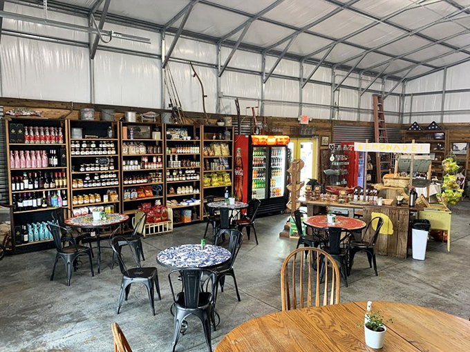 The dining area feels like your coolest friend's garage after a magnificent makeover&mdash;industrial chic meets country store with those stunning mosaic tables stealing the show.