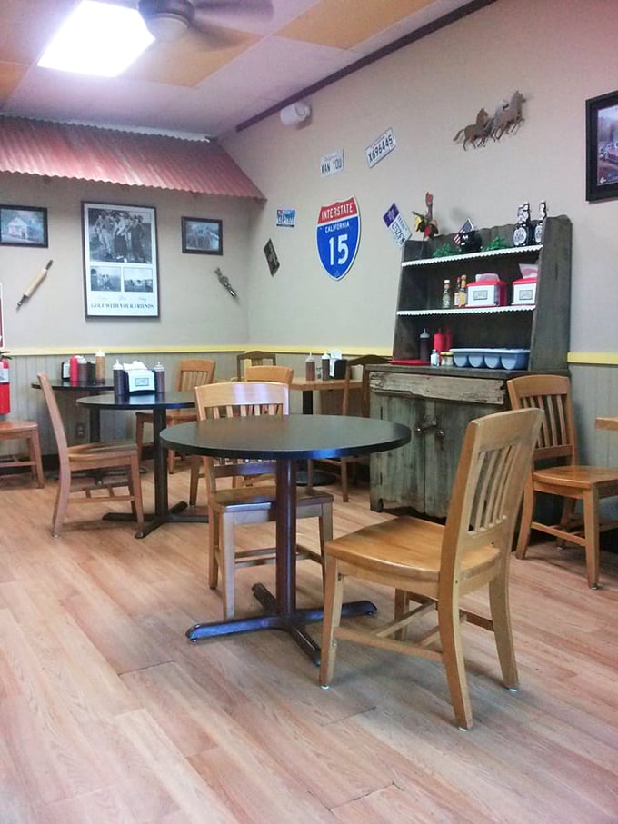 Simple tables, big flavors. The dining area's roadside charm, complete with highway signs and wooden chairs, lets you focus on what matters &ndash; the food.