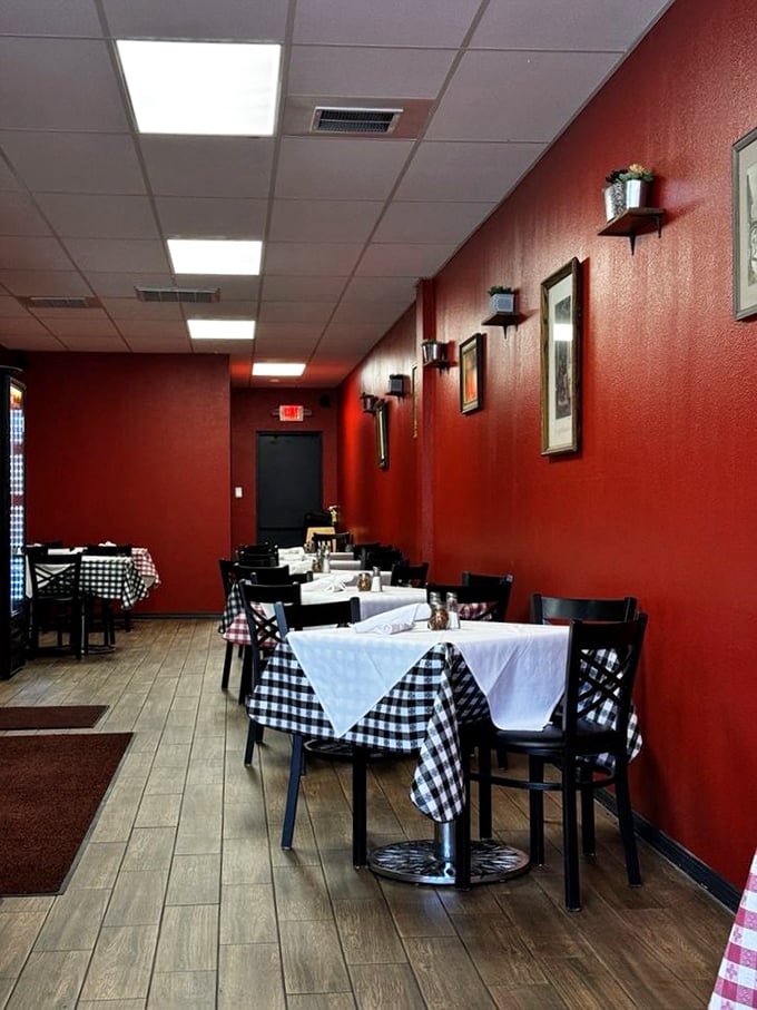 The dining room's simplicity lets you focus on what matters&mdash;the food. Those red walls practically pulse with the promise of deliciousness to come.