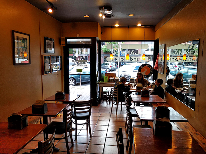 Clean lines, tile floors, and wooden tables create a no-nonsense atmosphere where the food remains the undisputed star.