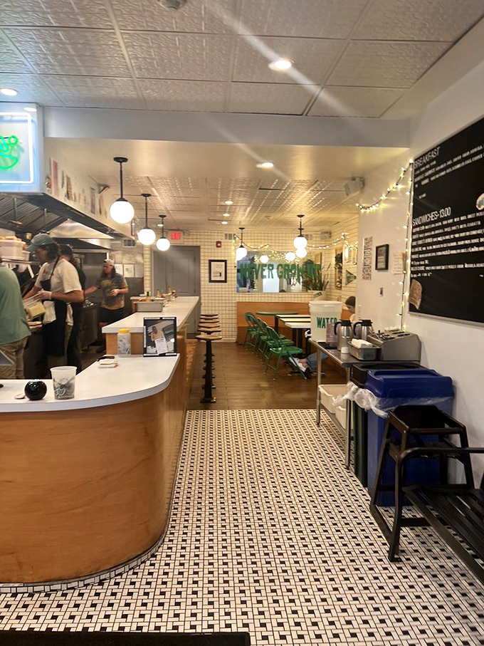 The counter seating offers front-row tickets to the sandwich-making show, where every slice and spread becomes performance art. 