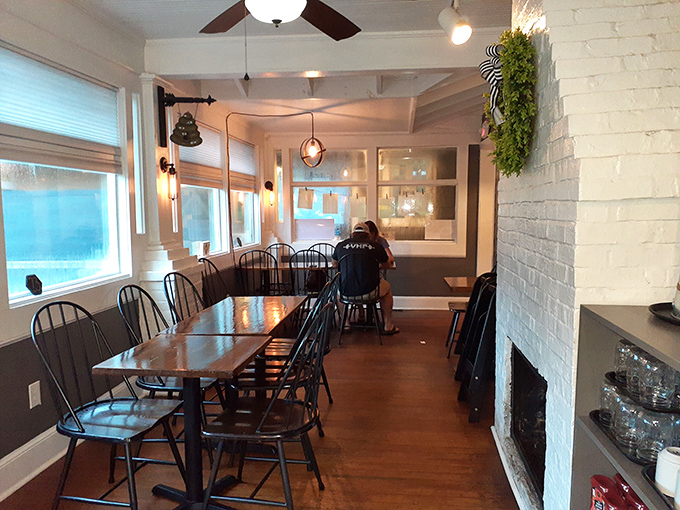 White brick, wooden beams, and sunlight streaming through windows&mdash;this dining room feels like breakfast at your stylish friend's country cottage.