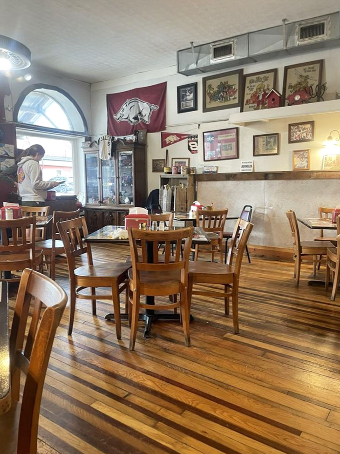 Arkansas Razorbacks memorabilia watches over diners like guardian angels. In this room, calories don't count and diet talk is strictly prohibited.