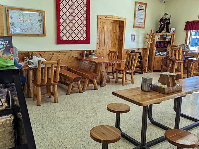 Rustic log furniture practically begs you to sit a spell, a tactical design choice ensuring you'll stay long enough to justify "just one more" treat.