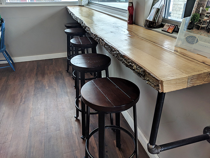 That live-edge countertop with industrial stools isn't just seating&mdash;it's front-row tickets to the best show in town: breakfast.