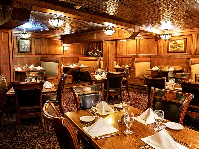 A warm, wooden atmosphere awaits as you settle into a cozy booth for a timeless dining experience filled with charm.
