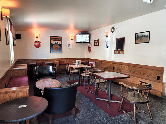 The dining area waits patiently for the evening rush, its wooden charm and cozy corners promising conversations that last longer than the food.