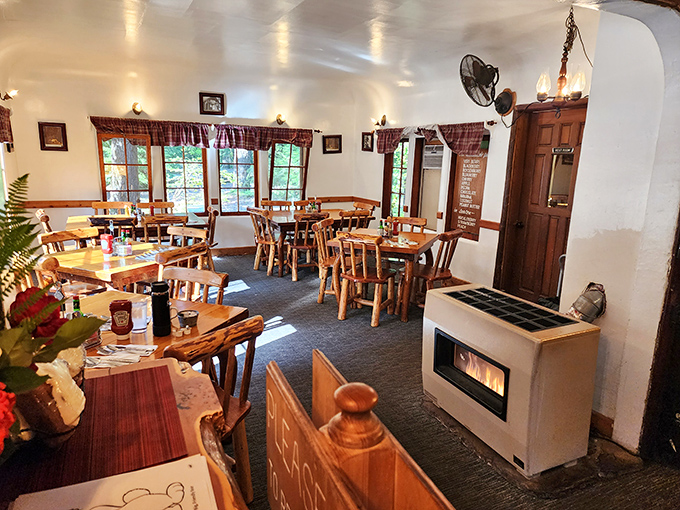 Rustic wooden tables bathed in natural light from picture windows&mdash;Mother Nature's dining room with better service and no mosquitoes. 