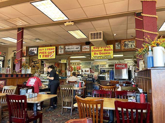 Red pillars, nostalgic signage, and the promise of "Buy 3 Fried Pies Get 1 FREE!" The dining area at Jimmy's feels like stepping into a time capsule of Americana.