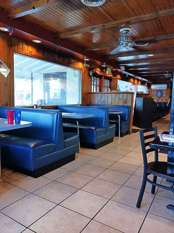 Classic blue vinyl booths&mdash;where countless first dates, family breakfasts, and "I've had a rough day" dinners have unfolded. Wood paneling included at no extra charge.