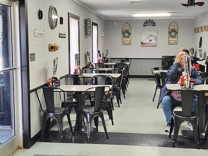 The dining area's simple charm says, "Stay awhile," with decor that whispers stories of decades of community gatherings.