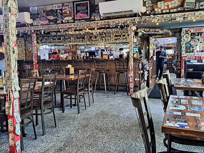 The dining area where strangers become friends. Every table tells stories through its collection of business cards preserved under epoxy.
