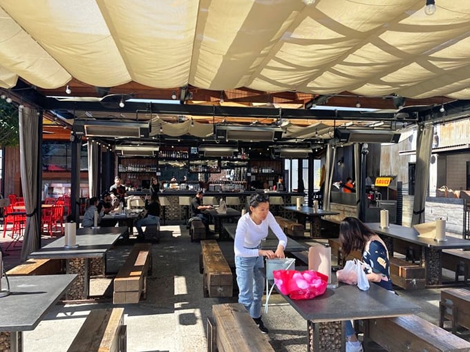 The dining area blends indoor-outdoor living perfectly&mdash;because why choose between San Diego sunshine and chicken-induced happiness when you can have both?