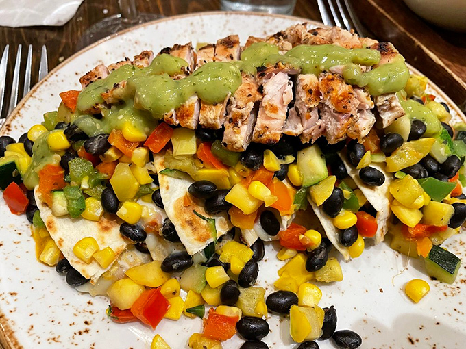 Farmer's Market Quesadilla—where grilled chicken lounges atop a colorful fiesta of vegetables like it's on a well-deserved vacation.