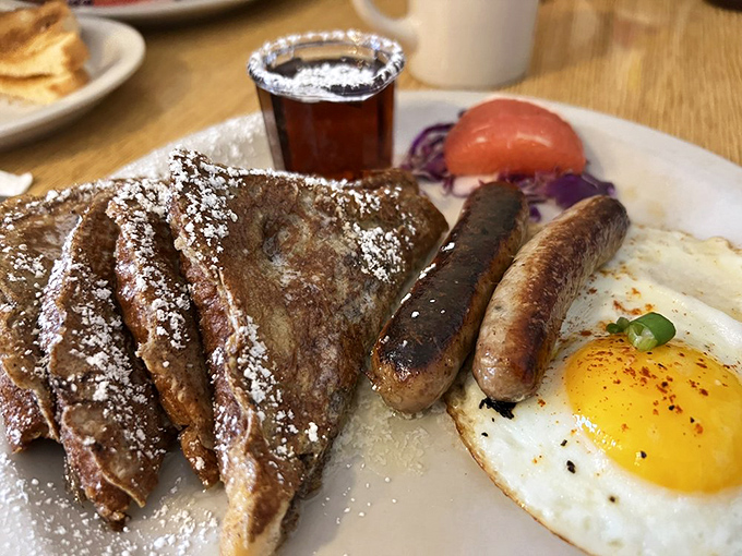 That omelet's golden exterior hides a world of flavor within, while those hash browns have achieved the perfect crisp-to-tender ratio. Breakfast engineering at its finest.