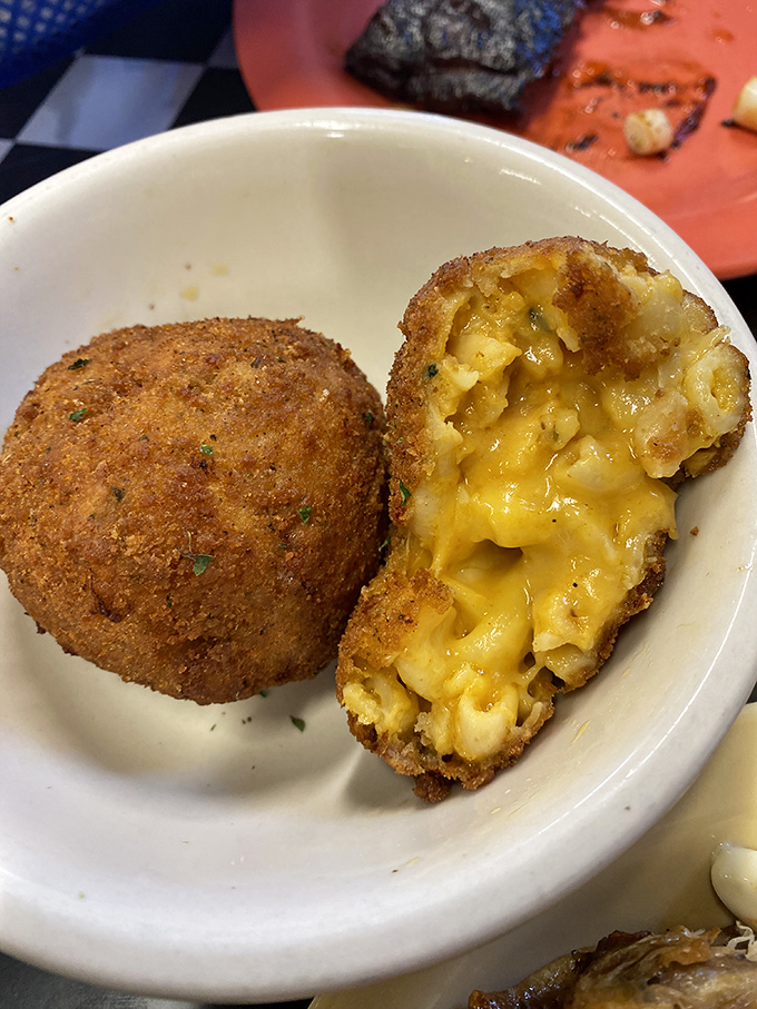 Fried mac & cheese balls&mdash;because someone brilliant decided that mac & cheese wasn't quite indulgent enough and needed a crispy golden jacket.