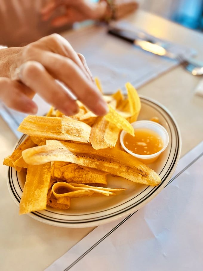 Plantain chips so perfectly golden and crisp, they make potato chips look like they're not even trying. The dipping sauce is liquid sunshine.