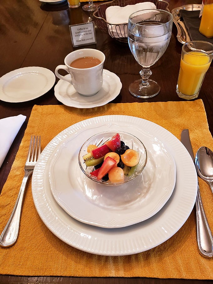 Fresh fruit served with artistic flair starts the morning right, paired with steaming coffee in fine china&mdash;because paper cups have no place here.