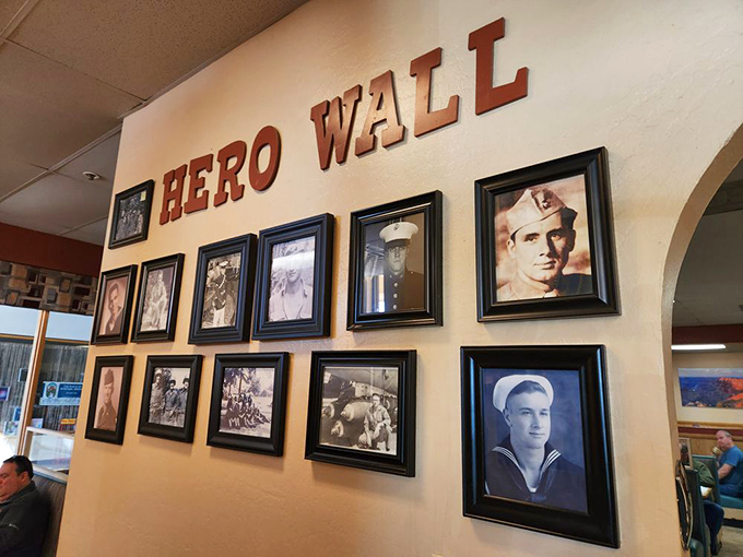 The "Hero Wall" displays photos of veterans &ndash; a heartfelt tribute that reminds you this restaurant understands it's serving a community, not just customers.