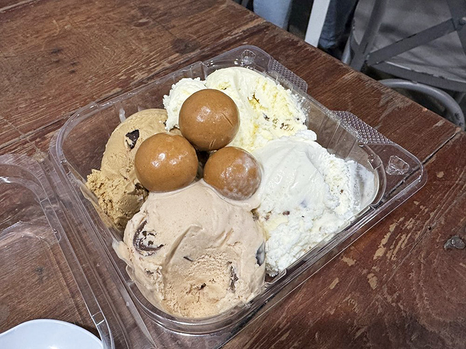 The ice cream flight that will ruin all other desserts for you. Four flavors, three little balls, and one very big smile.