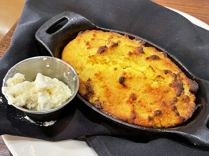 Cornbread that arrives looking like savory cupcakes, with honey butter melting into every warm, crumbly bite.