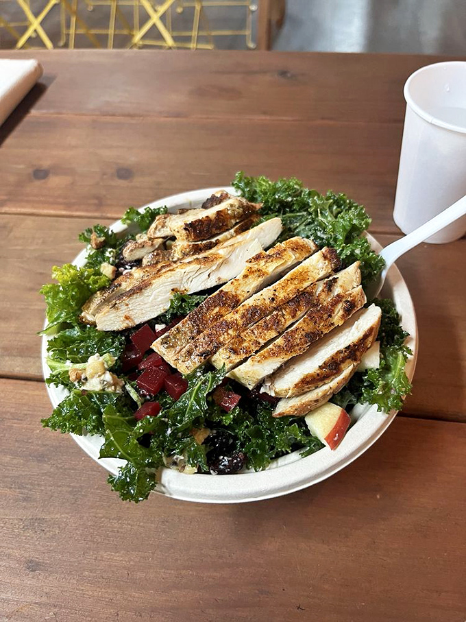 This chicken sandwich nestled in brown paper is like receiving a love letter from the kitchen &ndash; simple, honest, and straight to the heart. 