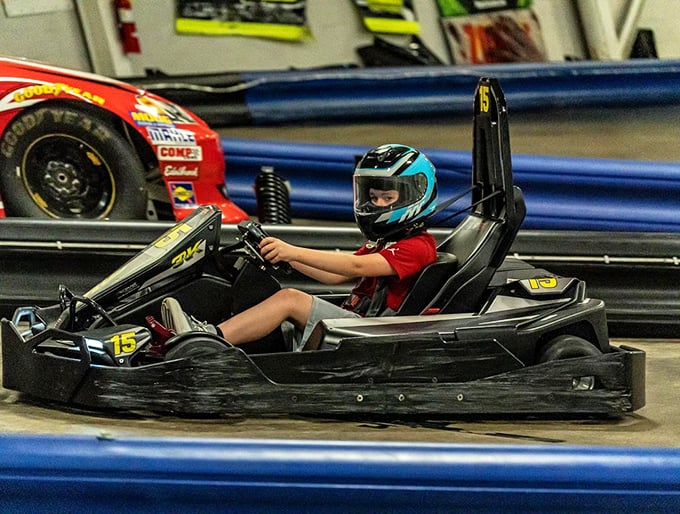 The exterior at night has that "secret clubhouse for speed enthusiasts" vibe. Like Batman's garage, but with more public access. 