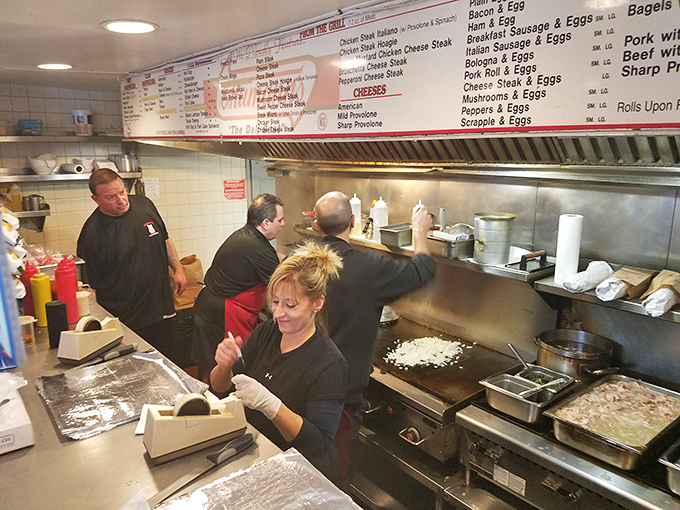 Behind the counter, sandwich artisans perform their daily ritual, transforming simple ingredients into legendary meals.