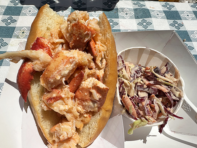When lobster meat spills over the edges of your roll like this, you know you've found seafood heaven on the Massachusetts coast.