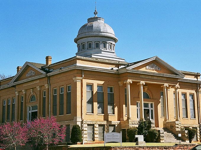 The Oklahoma Territorial Museum's stately dome watches over Guthrie like a proud parent, preserving the wild tales of territorial days.