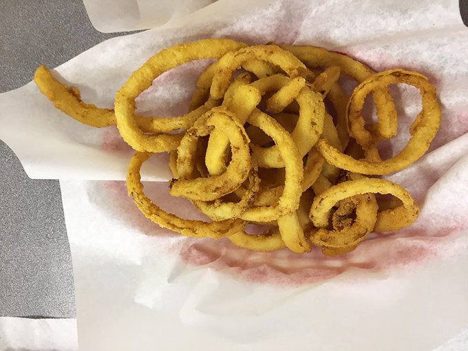 These aren't just onion rings; they're golden halos of happiness, hand-breaded and fried to the kind of perfection that makes you forget vegetables are supposed to be healthy.