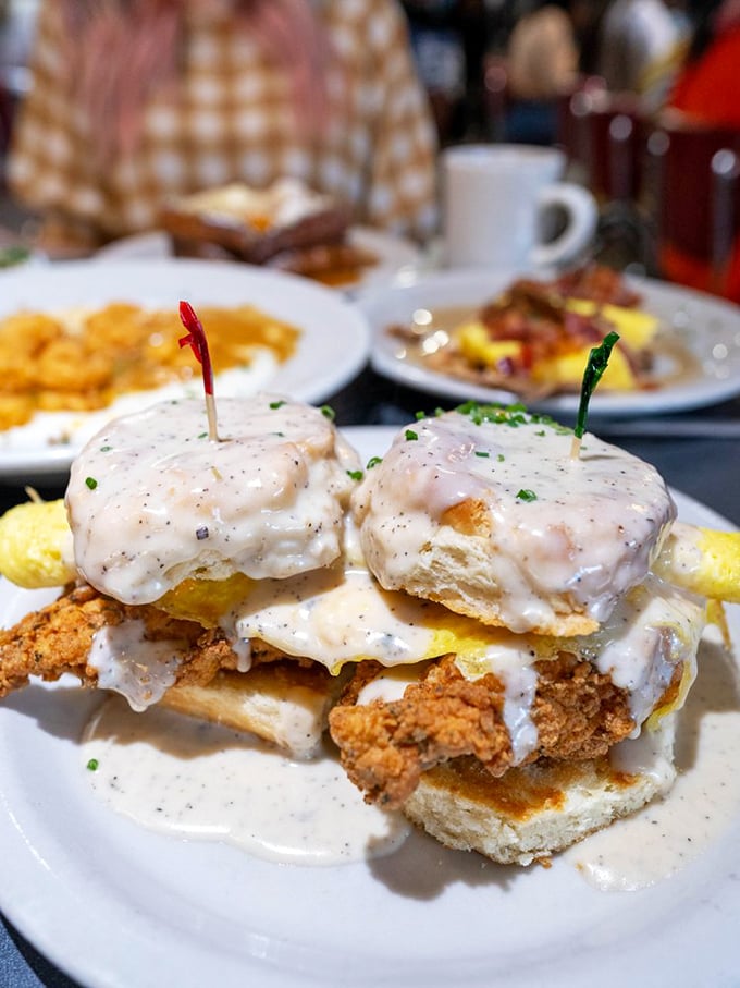 This isn't just another breakfast sandwich &ndash; it's architectural genius stacking crispy chicken and eggs between heavenly biscuits.