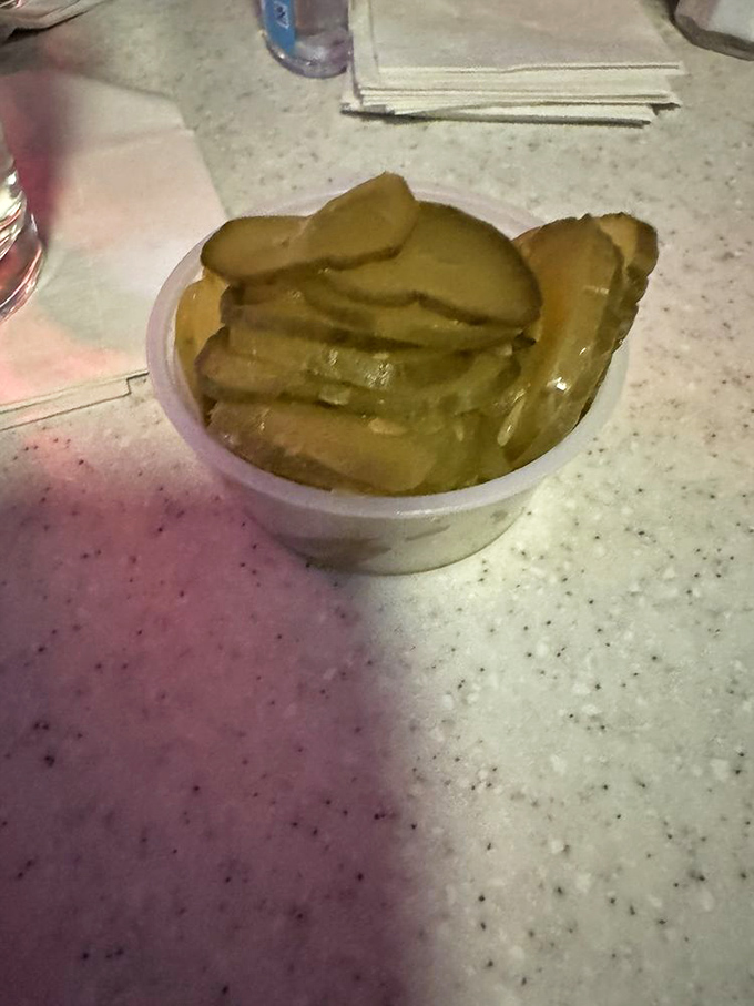 These aren't artisanal pickles with a backstory. They're just really good dill slices that know their supporting role in the burger drama.