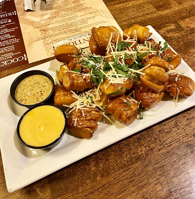 These aren't just pretzel bites &ndash; they're golden-brown flavor bombs, showered with parmesan and herbs, begging to be dunked in liquid gold. 