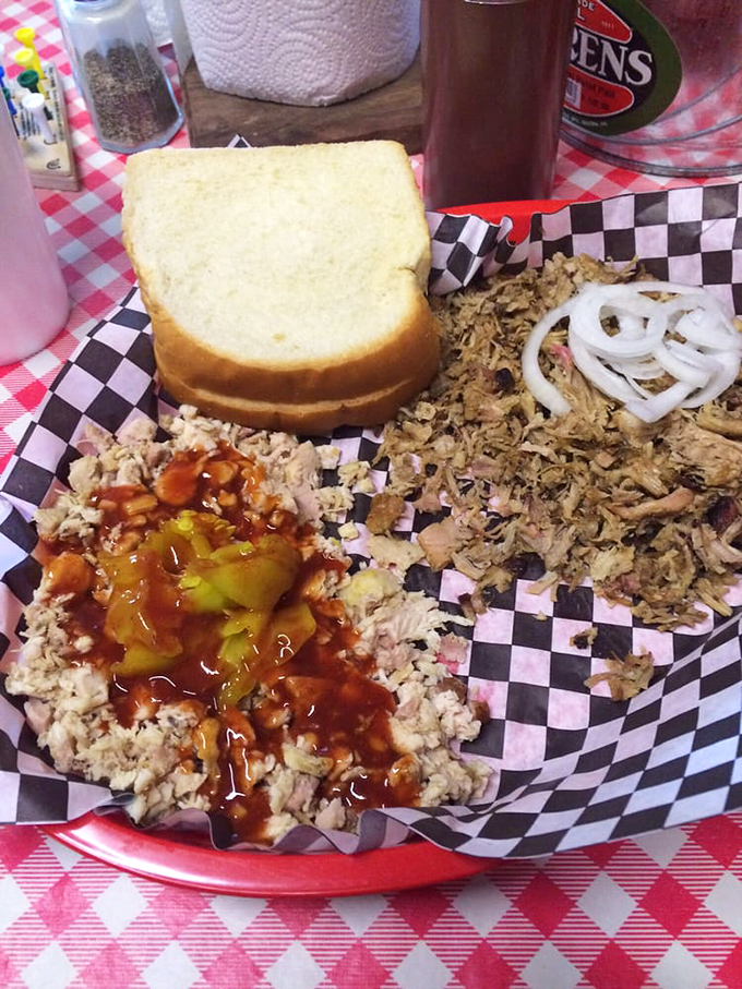 Two meats are better than one: pulled chicken and chopped pork with sauce and raw onions&mdash;a barbecue duet that sings.