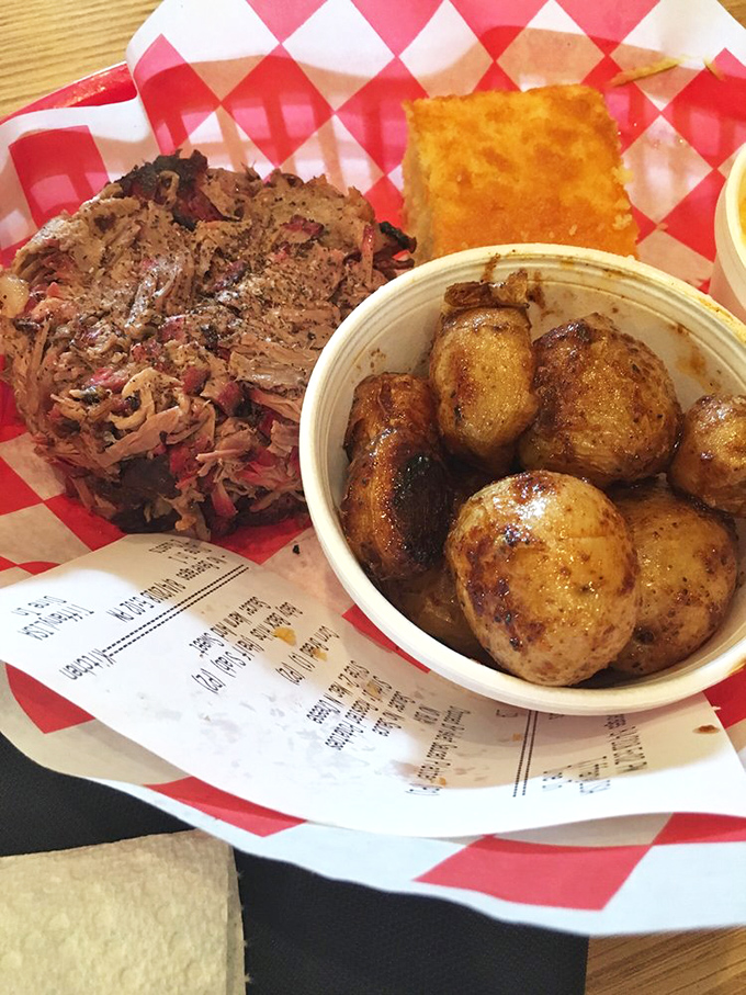 This pulled pork has been smoking longer than most rock bands. The seasoned potatoes are the backup singers we didn't know we needed.