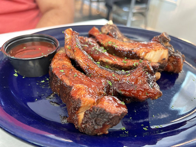 These ribs don't just fall off the bone&mdash;they leap willingly into flavor oblivion. The sauce alone deserves a standing ovation.