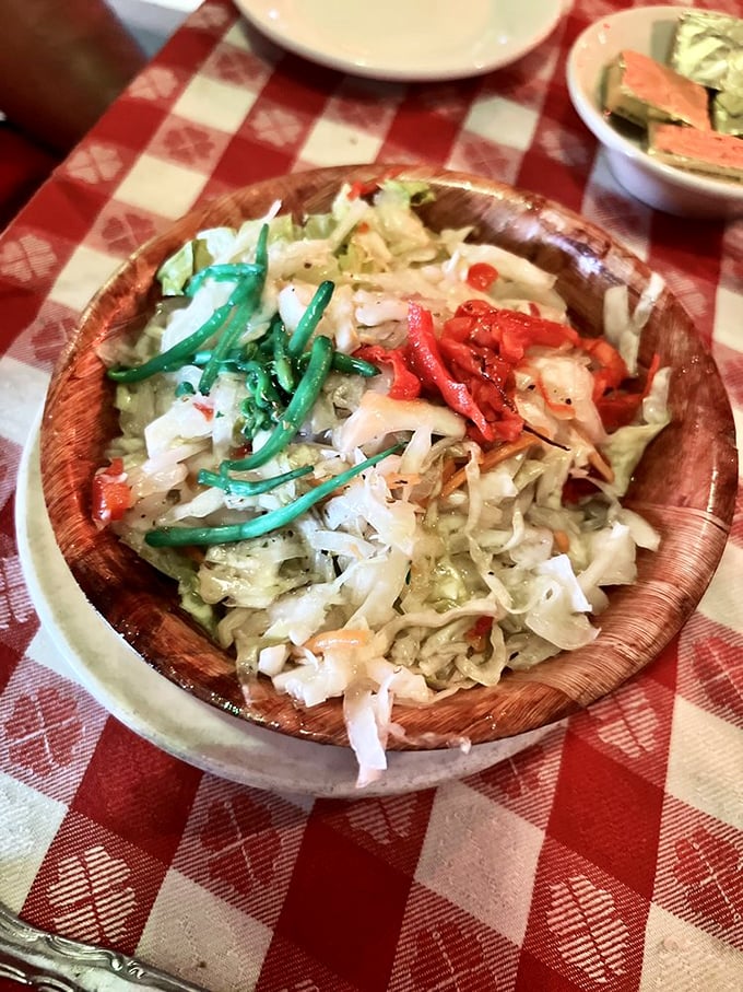 A wooden bowl of salad that somehow makes vegetables exciting. The perfect palate cleanser between pasta marathons.